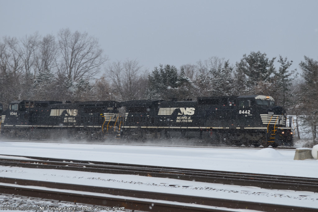 NS 8442 charges east in a snowstorm.